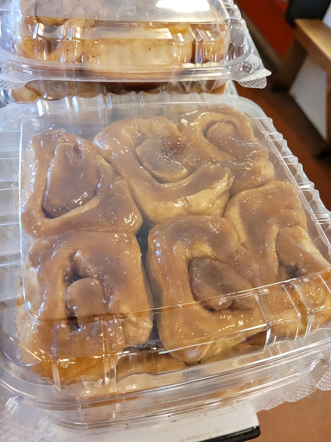 Cinnamon rolls the size of your face, glazed with enough sweetness to make your dentist wince and your taste buds sing hallelujah.