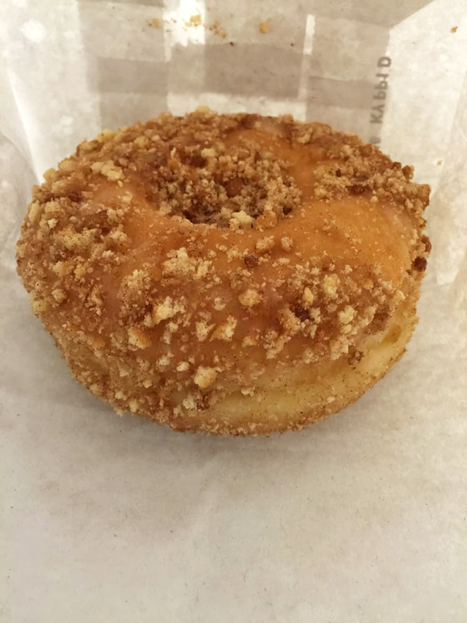 The cinnamon crumb donut wears its topping like a crown. That buttery streusel isn't just a garnish &ndash; it's the exclamation point at the end of a delicious sentence.