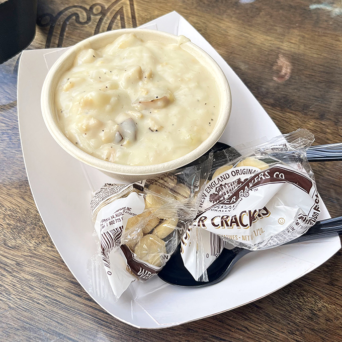 This clam chowder isn't just soup; it's a creamy hug in a bowl, with oyster crackers standing by for the perfect supporting role.