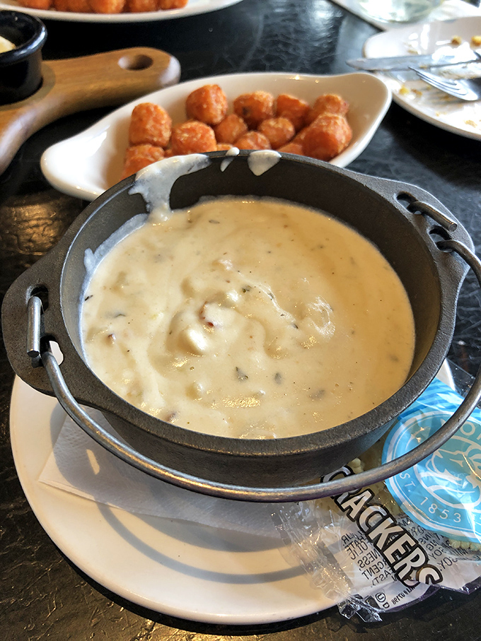 New England Clam Chowder served in a mini cast-iron pot—because good soup deserves dramatic presentation. Creamy, hearty, and worth every delicious calorie.