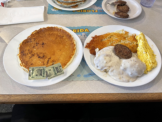 The holy trinity of breakfast: a giant pancake, eggs, and sausage gravy. Diets were made to be broken for plates like this.