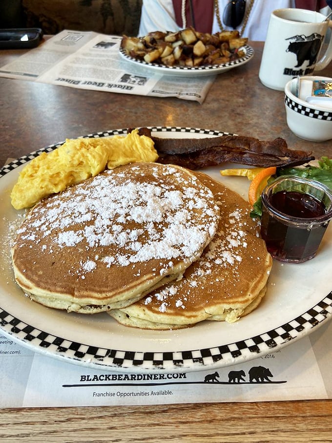 These aren't just pancakes&mdash;they're fluffy discs of breakfast perfection, dusted with powdered sugar and served with a side of morning happiness.
