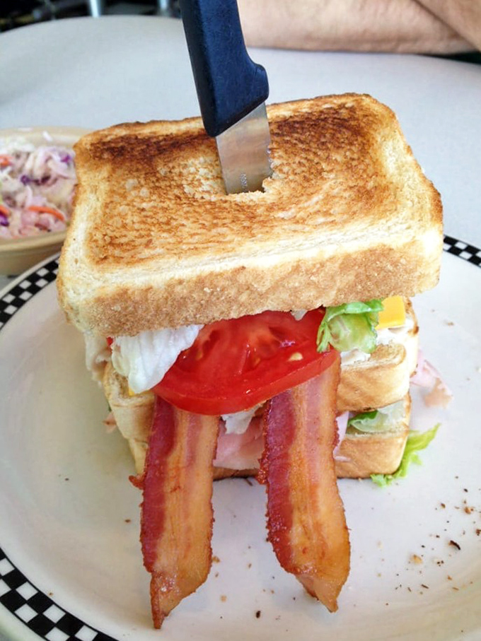 This club sandwich isn't playing around &ndash; perfectly toasted bread standing at attention while bacon salutes your good taste decisions.