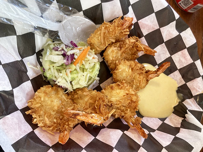 Golden-armored shrimp standing at attention. These coconut-crusted beauties are the tropical vacation your taste buds didn't know they needed.