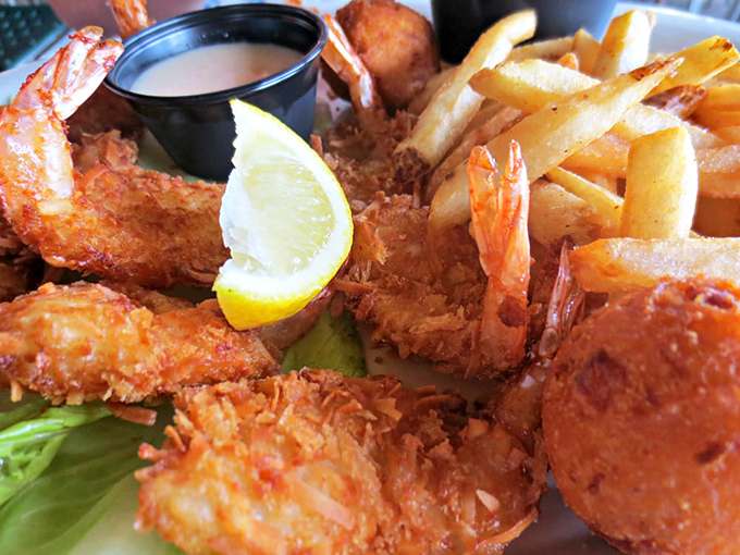 Golden-fried coconut shrimp that would make Robinson Crusoe weep with joy, paired with a dipping sauce worth swimming across the Gulf for.