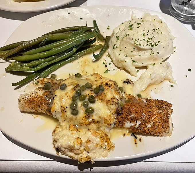 Cod Imperial &ndash; where fish gets dressed for the gala, adorned with capers and a sauce that would make butter jealous.