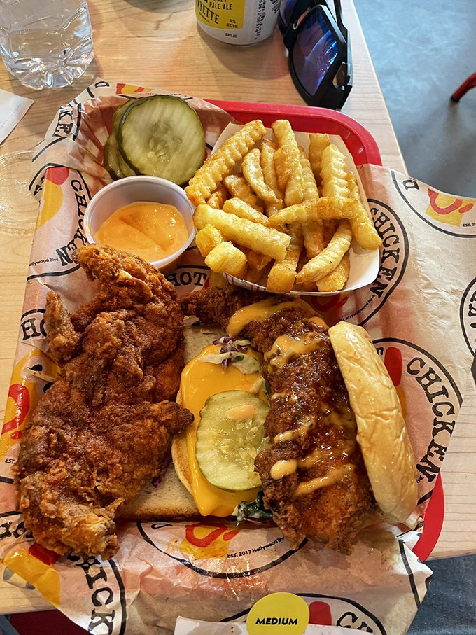 A holy trinity of comfort food: crispy tenders, a cheese-draped slider, and perfectly seasoned fries&mdash;proof that good things come in threes.