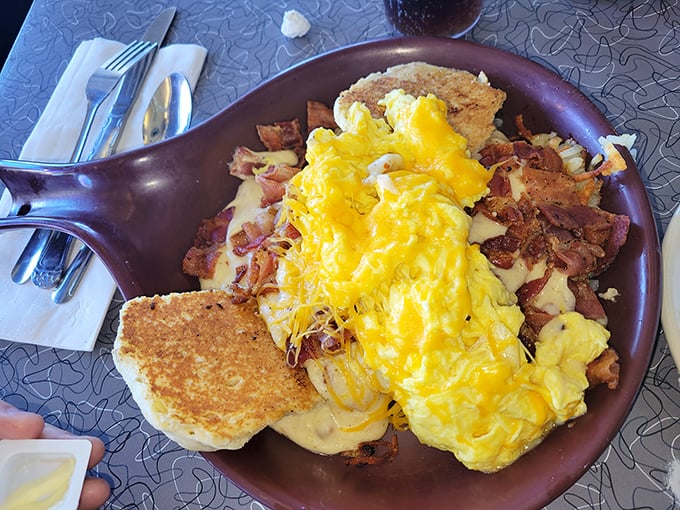 This skillet of corned beef hash topped with melted cheese and toast soldiers might be the breakfast equivalent of winning the lottery.