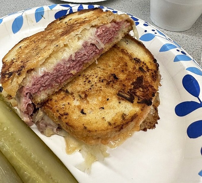 This isn't just lunch&mdash;it's edible history. The perfect ratio of corned beef to sauerkraut creates a sandwich symphony that Mozart would envy.