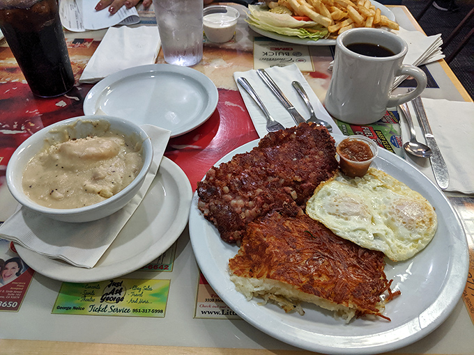 Behold the holy trinity of breakfast &ndash; crispy corned beef hash, eggs with yolks like liquid sunshine, and hash browns that crackle with each forkful.