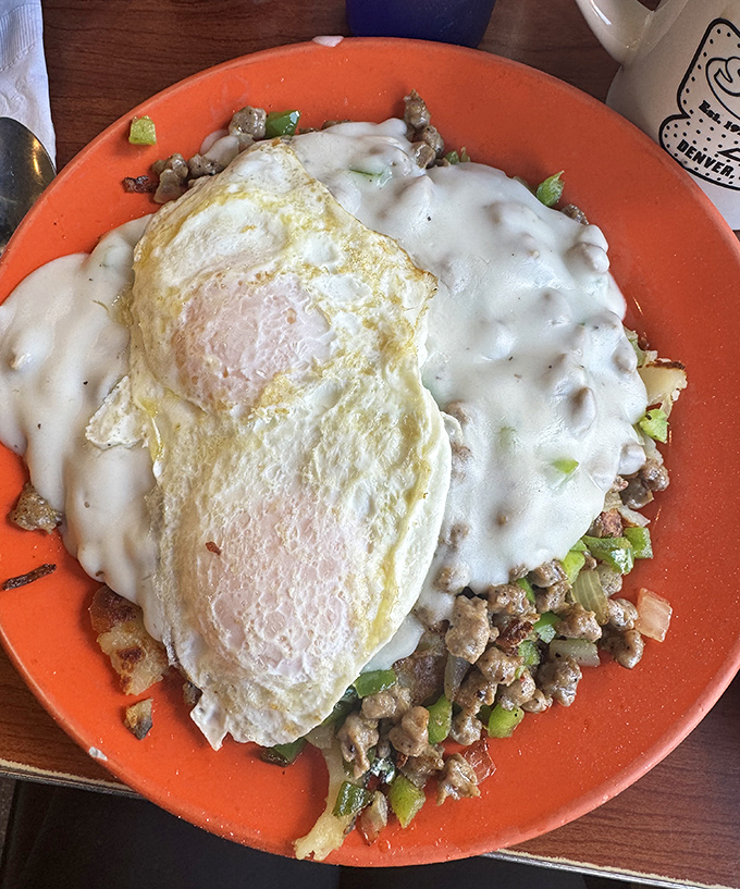 Breakfast alchemy at its finest: eggs, meat, potatoes, and gravy combine into a morning masterpiece that makes alarm clocks worth tolerating.