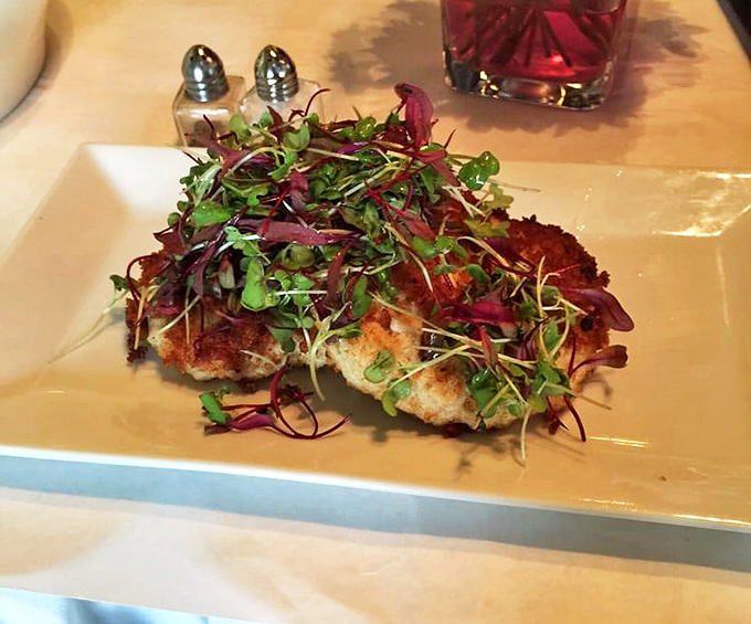 Crab cakes so perfectly golden and topped with microgreens that make you momentarily forget you're not dining oceanside.