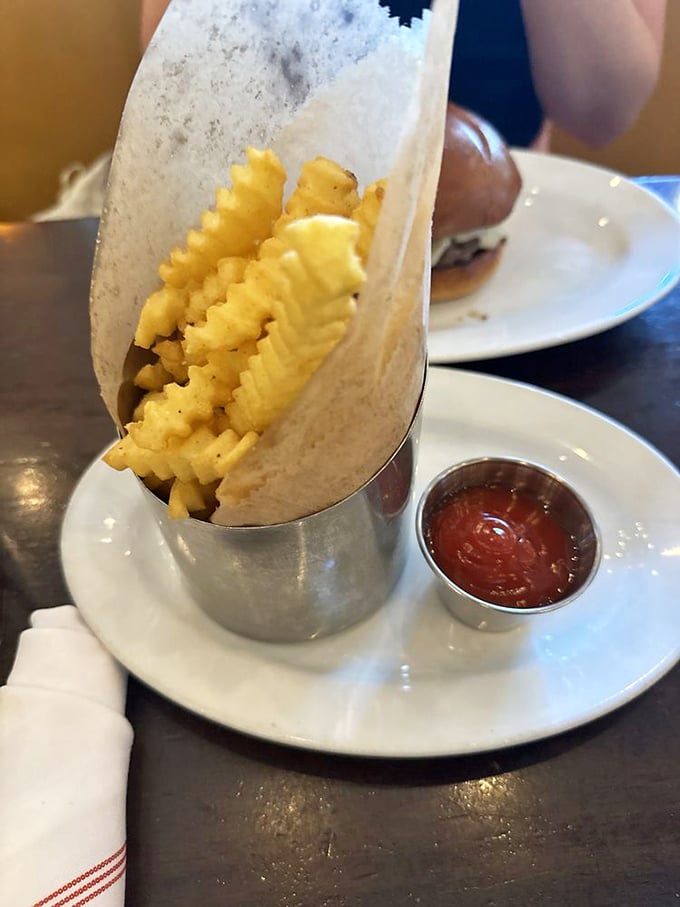 Crinkle-cut fries dressed in their finest cheese and parmesan outfit. Like potato royalty attending the most delicious gala in town.