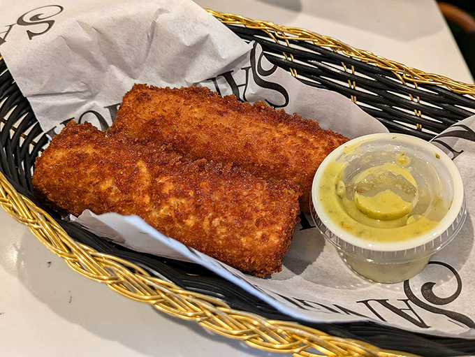 Golden-brown croquetas that shatter with a satisfying crunch, revealing a creamy interior. Resistance is futile, order two baskets.