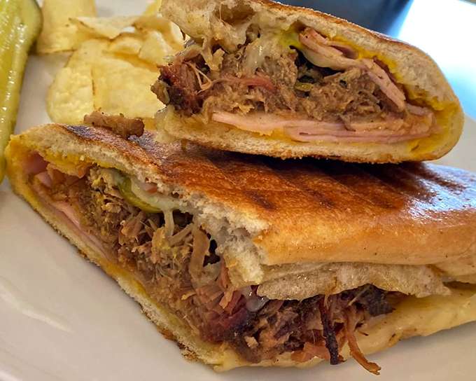 The pressed Cuban&mdash;where ham, pork, and cheese meet heat and pressure to create something greater than the sum of its parts. Physics never tasted so good.