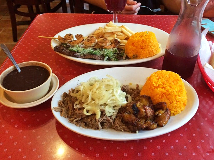 A plate that answers the eternal question: "Why is everyone smiling in this restaurant?" Yellow rice, tender meat, and black beans—the holy trinity of Cuban comfort.