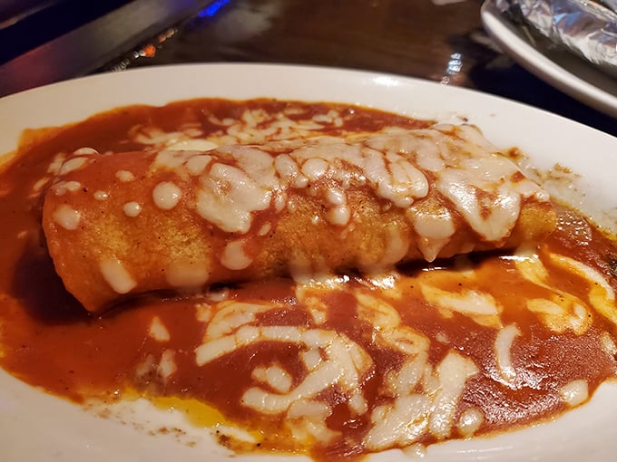 Sauce-drenched and cheese-crowned, this burrito doesn't just satisfy hunger &ndash; it negotiates peace treaties with your taste buds.