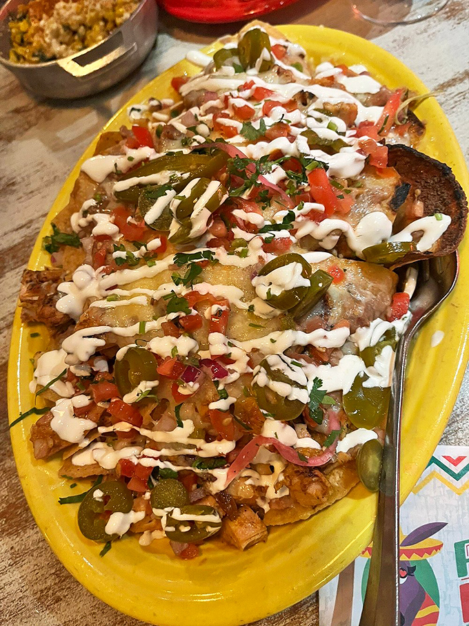 A fiesta of flavors arranged in a silver chariot. Those pickled red onions add the perfect tangy counterpoint to the rich cheese.