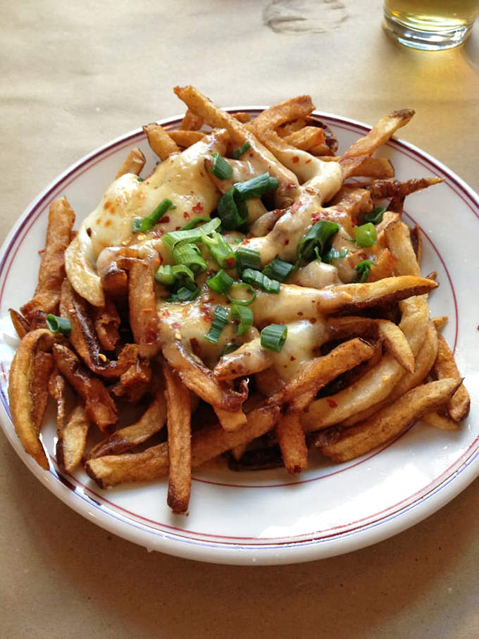 Disco isn't dead&mdash;it's alive on this plate where fries meet melty cheese, green onions, and enough flavor to make you do the hustle.