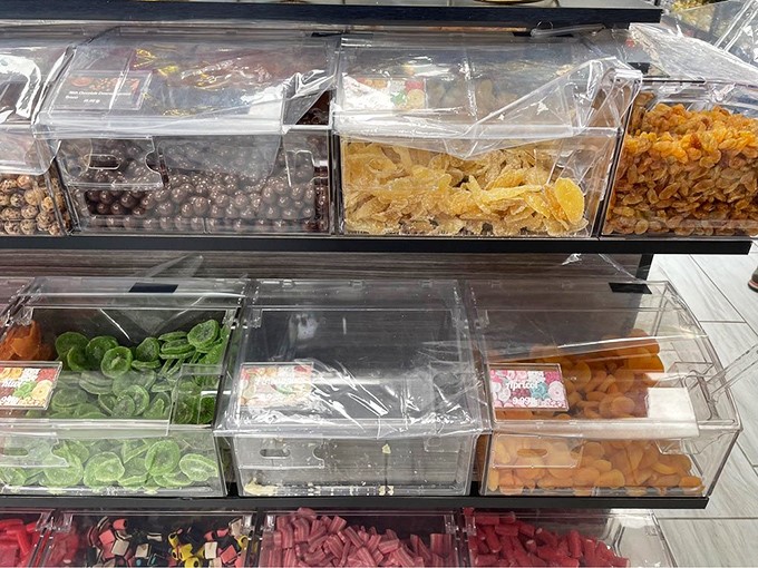 Candy bins lined up like soldiers ready for duty. The hardest battle you'll face is deciding which colorful treat deserves your attention first.