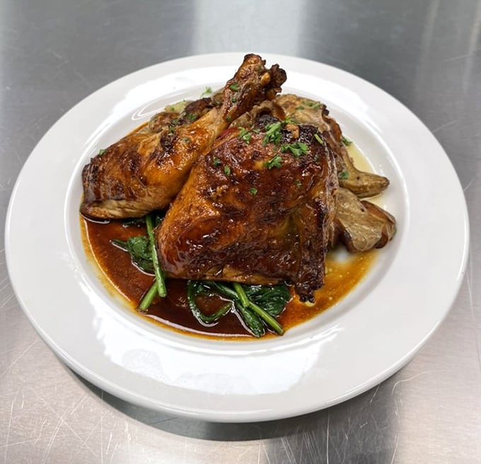 Duck confit that would make a French chef nod in approval, proving Tops has evolved far beyond the "burger and fries" diner stereotype.