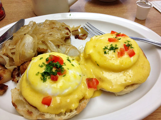 Eggs Benedict that would make the snobbiest brunch enthusiast nod in approval&mdash;golden hollandaise cascading over perfectly poached eggs like a breakfast waterfall.