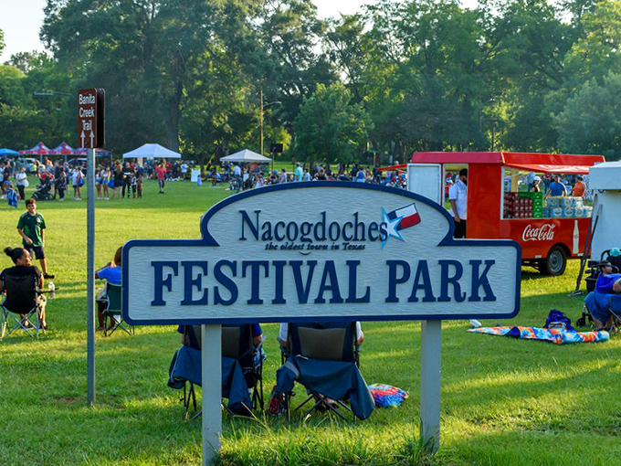 Festival Park: where strangers become neighbors over live music and local fare. The only thing more welcoming than the sign is the crowd.