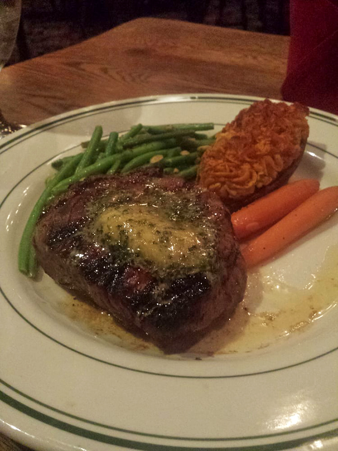 A filet mignon that's been cooked with such respect and precision, it deserves its own thank-you note, accompanied by vegetables that didn't just show up for the party.