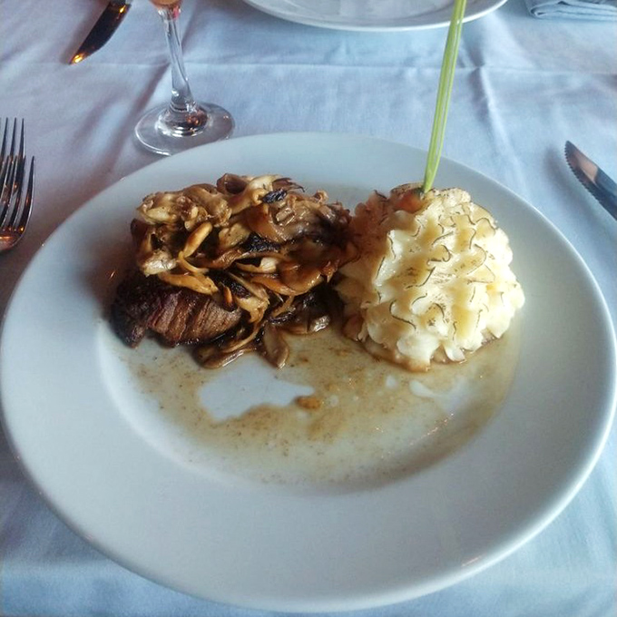 A perfectly seared filet mignon shares the spotlight with saut&eacute;ed mushrooms and cloud-like mashed potatoes&mdash;proof that sometimes the classics need no reinvention.