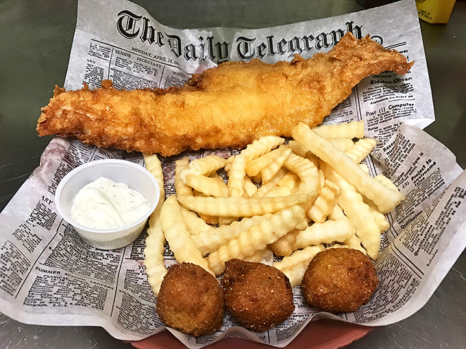 Fish and chips served on newspaper&mdash;a crispy, golden-battered tribute to simplicity that would make even British pubs nod in approval.