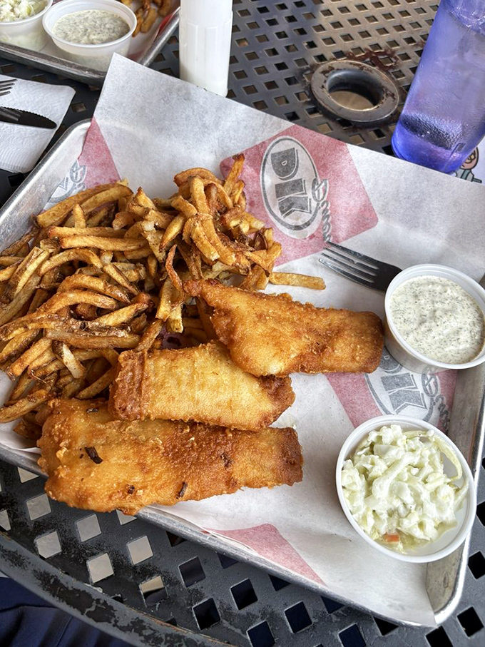 Fish and chips that would make a British pub nervous. Crispy, golden perfection with slaw that actually deserves to be eaten, not pushed aside.