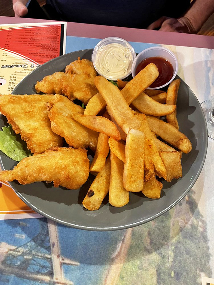Golden-battered fish that shatters with each bite, paired with fries that achieve the perfect balance between crisp exterior and fluffy interior. Seafood nirvana.