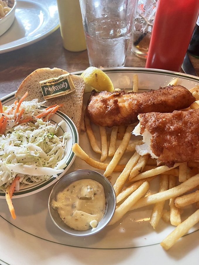The fish fry &ndash; Wisconsin's Friday religion. Crispy, golden perfection with coleslaw that actually deserves to be on the plate, not just color coordination.