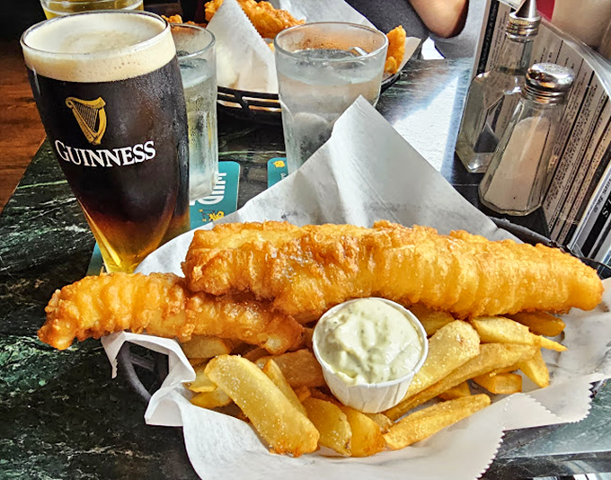 That perfect moment when golden fish meets cold Guinness—a pairing so harmonious it should have its own symphony.