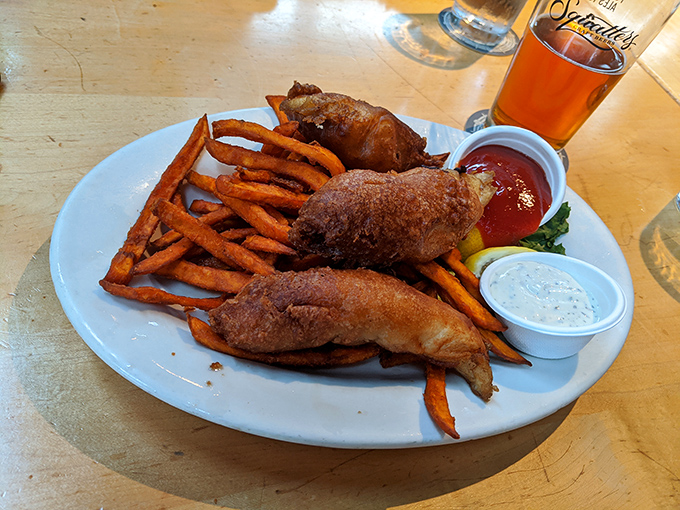 The sweet spot where comfort food meets craft beer. Those crispy morsels of fish alongside sweet potato fries create a plate of pure joy.