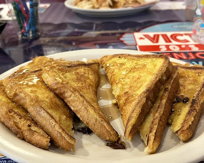 French toast that's achieved the golden ratio of crispy exterior and custardy interior. Maple syrup pools in all the right places, making breakfast feel like a justified indulgence.