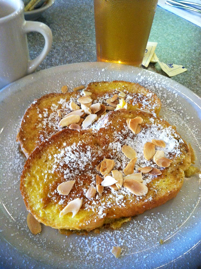 French toast that transcends ordinary breakfast fare. Those toasted almonds aren't just toppings&mdash;they're the crown jewels of morning indulgence.