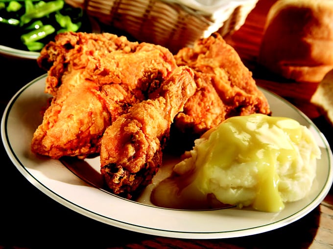 Fried chicken so perfectly golden it deserves its own trophy, alongside mashed potatoes that clearly never met a powder packet.