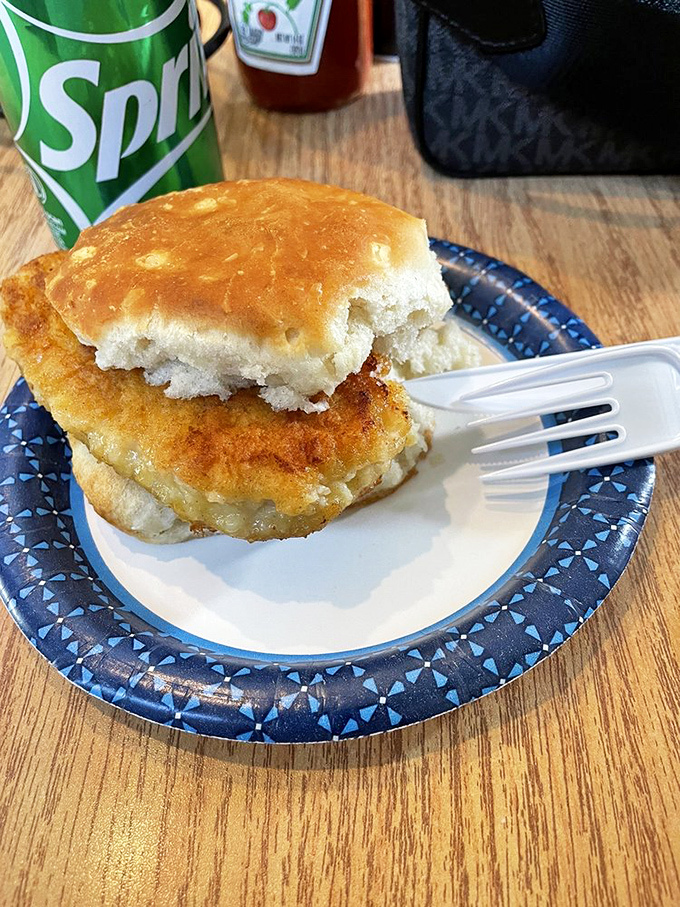 Breakfast sandwich nirvana achieved! A golden-brown biscuit embracing what appears to be a perfectly fried chicken cutlet&mdash;portable comfort at its finest.