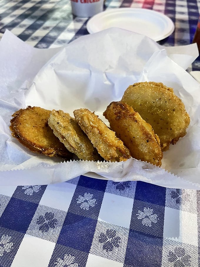 Golden-brown discs of fried green tomatoes&mdash;tangy, crispy, and the perfect opening act before the main chicken event.
