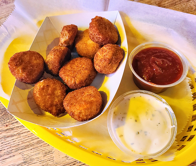 Golden-brown nuggets of pickle perfection. These hand-breaded, deep-fried dill delights might just upstage the famous hot dogs themselves.