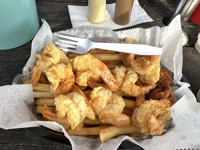 Golden-fried shrimp nestled on a bed of fries&mdash;proof that sometimes the simplest pleasures deliver the most profound satisfaction.