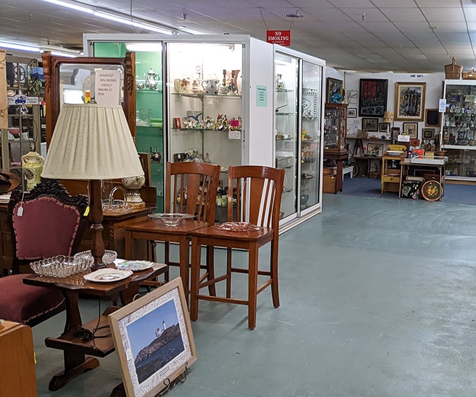 Elegant chairs and display cases create intimate vignettes throughout the marketplace. That lamp has probably witnessed more family dinners than your Thanksgiving turkey.