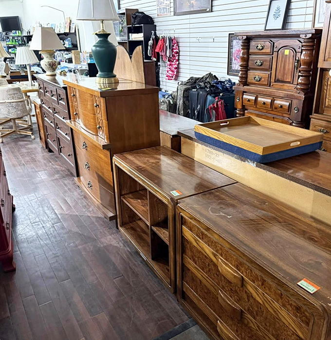 Solid wood furniture with stories to tell lines these aisles. That dresser probably witnessed more family dinners than most restaurants.