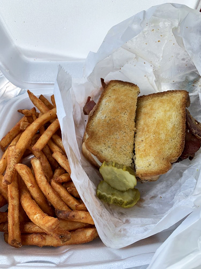 The grilled bacon hamburger sits proudly beside crinkle-cut fries &ndash; a duo that's been making Americans happy since before TikTok food trends were even a concept.