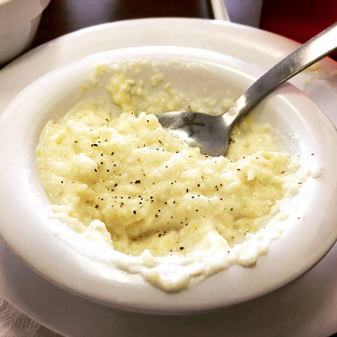 Grits so creamy they'd make a Southern grandmother weep with joy. The pepper flecks aren't just garnish&mdash;they're little flavor bombs waiting to explode. 