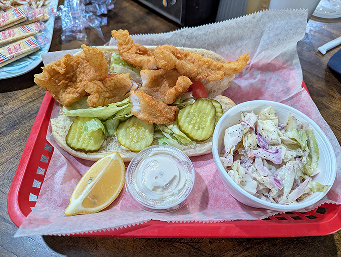 The grouper sandwich&mdash;golden, crispy perfection nestled on a bun with just enough accompaniments to enhance, not overwhelm. This is why people drive for hours.