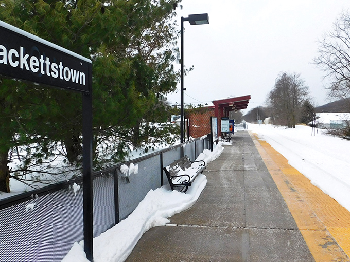 The train platform in winter looks like the opening scene of a Hallmark movie, where city slickers discover the charm of small-town life one snowflake at a time.