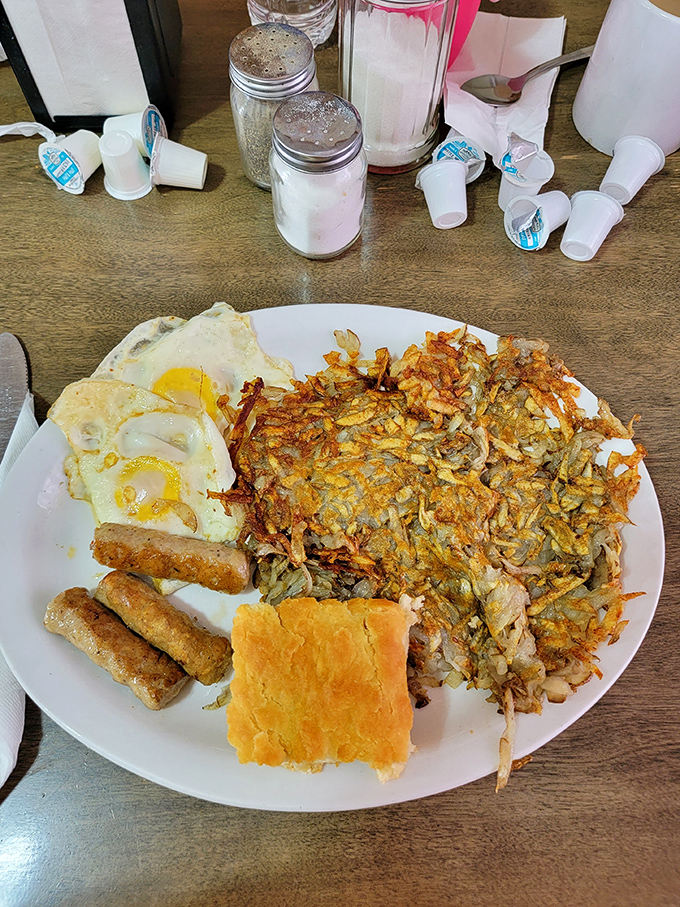 Breakfast of champions! Crispy hash browns, eggs, sausage links, and a biscuit that would make your grandmother both proud and jealous.
