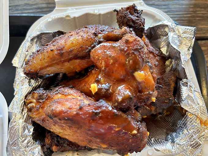 Wings that have clearly graduated with honors from Smoke University. That sauce isn't just clinging to the chicken&mdash;it's in a committed relationship.